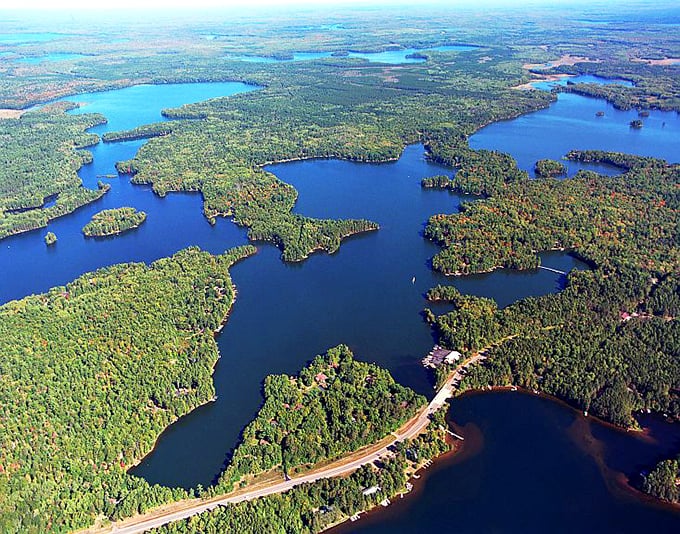 Nature painted with an extravagant brush in the Chain O' Lakes region &ndash; where forest green meets sky blue in perfect harmony.
