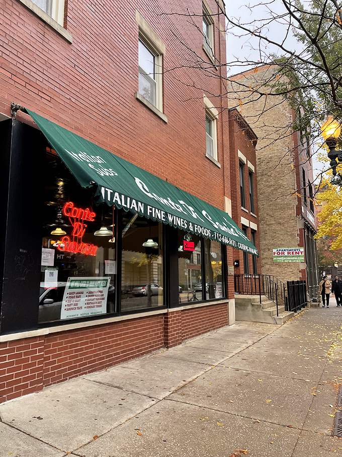 The warm glow of the "Conte Di Savoia" neon sign promises authentic Italian flavors that transport you straight to Rome, no passport required.