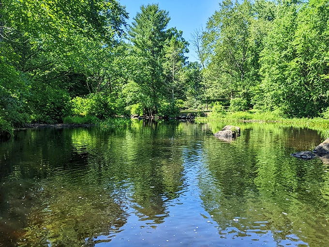 A wooden footbridge invites you to cross Devil's Hopyard&mdash;don't worry, despite the name, it's heavenly beautiful.