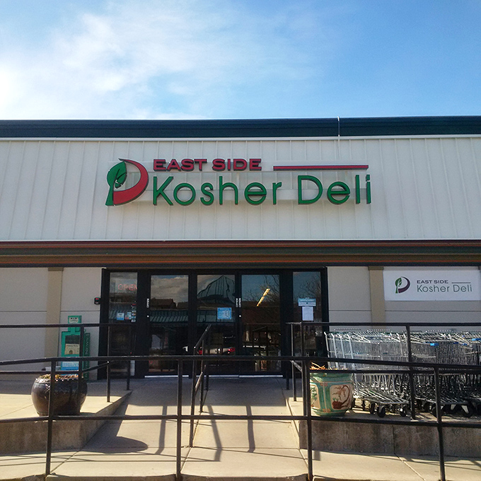 The shopping carts outside East Side Kosher Deli suggest the smart move: Get your sandwich first, then grocery shop while smiling.