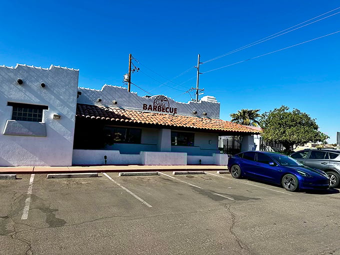 White stucco simplicity hides flavor complexity—the Clark Kent of barbecue joints, with superpowers in the smoker.