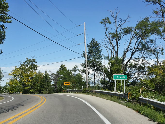 Sunset at Leland's harbor paints the fishing shanties in golden light, making even boat sheds look magical.