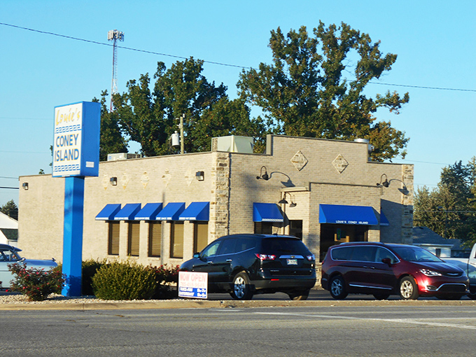 Those hand-painted window signs at Louie's aren't fancy, but they tell you everything you need to know. Come hungry, leave happy.