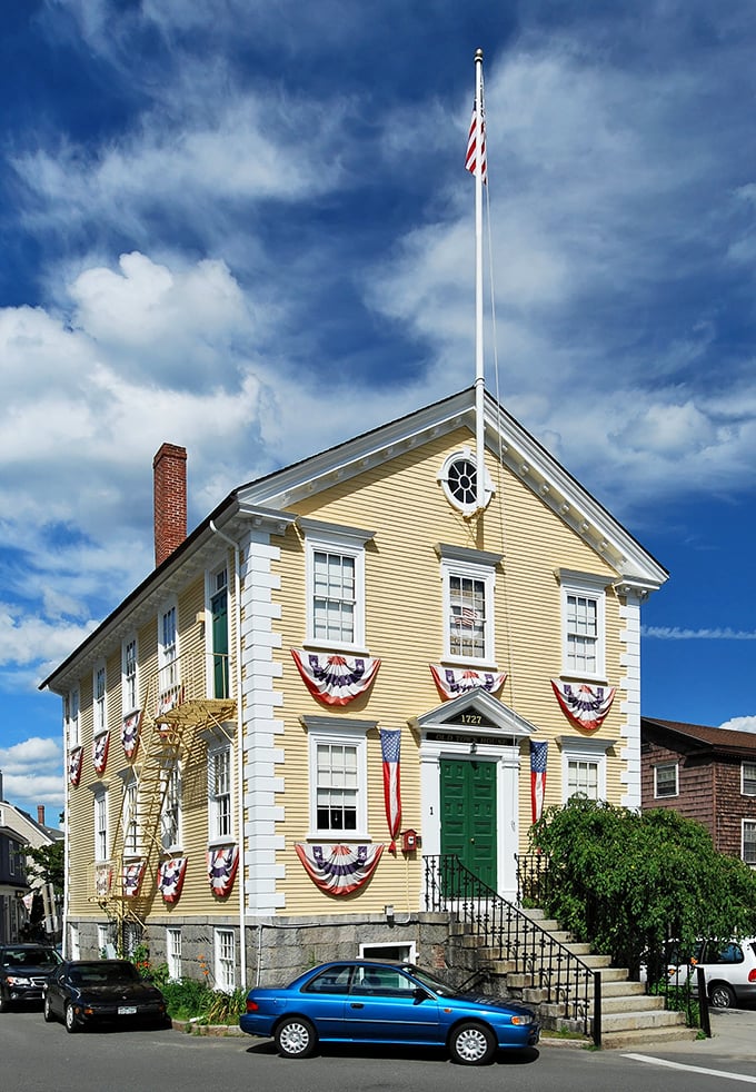 Marblehead's bright yellow building decorated with patriotic bunting – Norman Rockwell couldn't have painted it better.