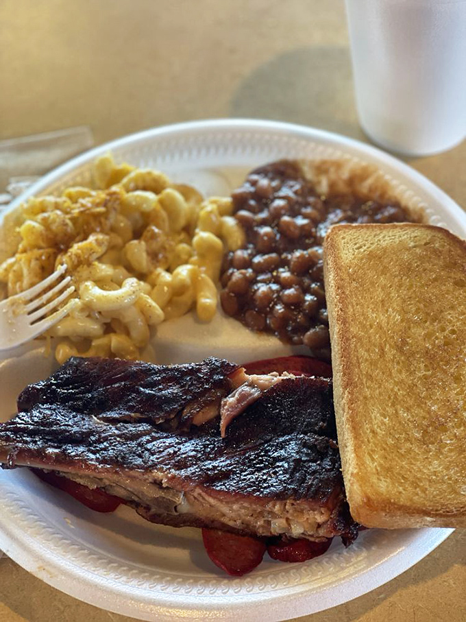 Mac and cheese that doesn't come from a blue box, beans with attitude, and meat that's been smoking longer than some folks have been driving.