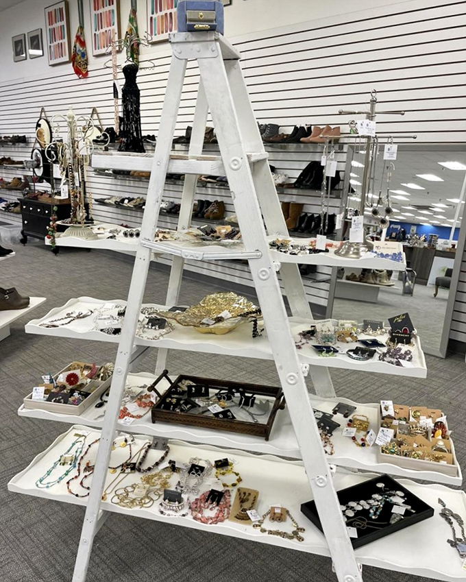 Jewelry displayed with gallery-like precision on a repurposed ladder&mdash;proof that creativity in merchandising is alive and well at Freedom House.