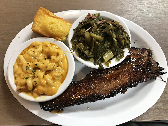 The holy trinity of Southern comfort: perfectly smoked brisket, creamy mac and cheese, and collard greens that would make your grandmother nod in approval.