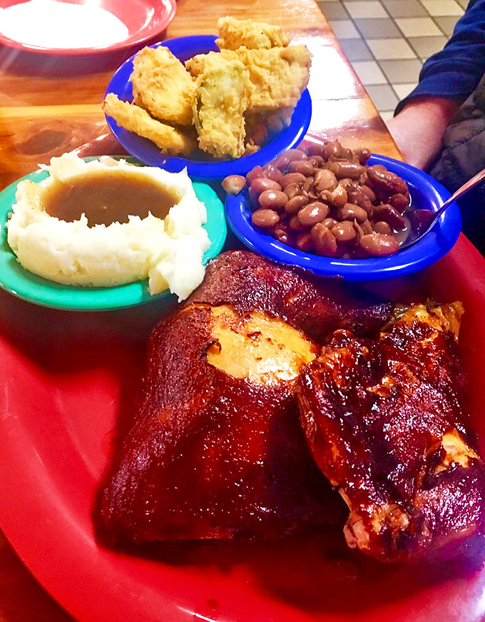 Country ham glowing with a mahogany sheen that would make fine furniture jealous, paired with sides that complete this Southern symphony.