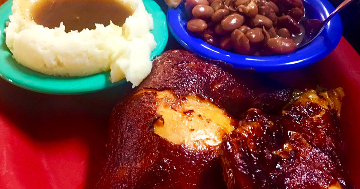 Country ham glowing with a mahogany sheen that would make fine furniture jealous, paired with sides that complete this Southern symphony.