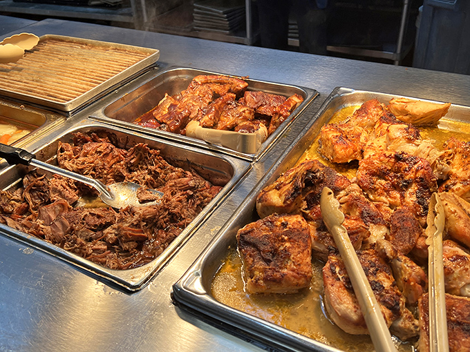 A trio of slow-cooked meats glistening with promise. This isn't just food&mdash;it's a commitment to the art of patience and proper seasoning.