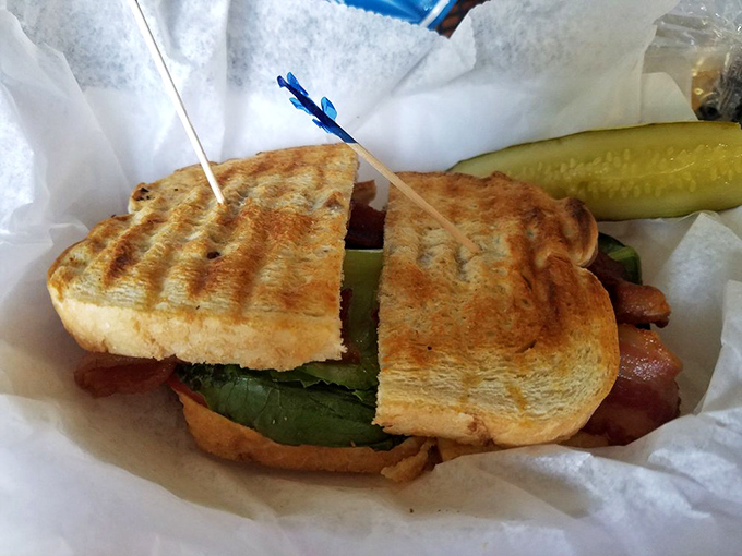 This isn't just a BLT; it's a masterclass in sandwich engineering where perfectly toasted bread meets the holy trinity of bacon, lettuce, and tomato.