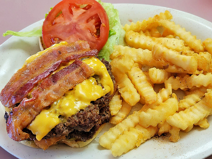 The burger your cardiologist warned you about. Those crinkle-cut fries aren't trying to be anything but their gloriously golden selves.