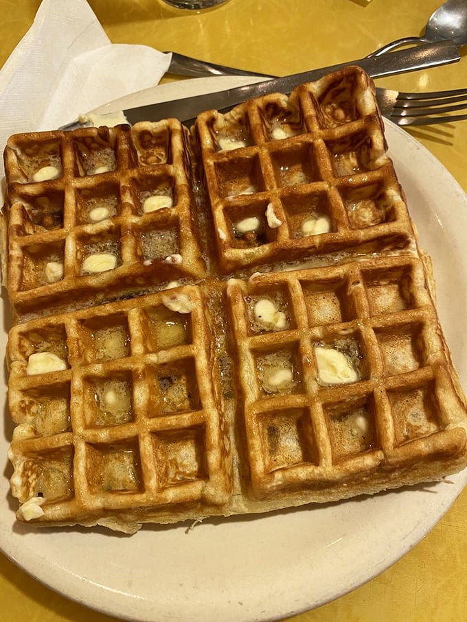 Waffles so crisp on the outside, tender inside, they'd make Belgian waffle purists weep with joy. Breakfast nirvana, served on a simple white plate.