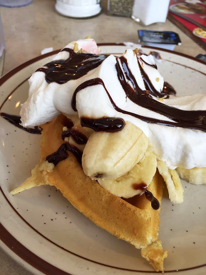 Behold the breakfast dessert of champions: a banana split waffle that makes you question why we ever relegated waffles to morning hours.