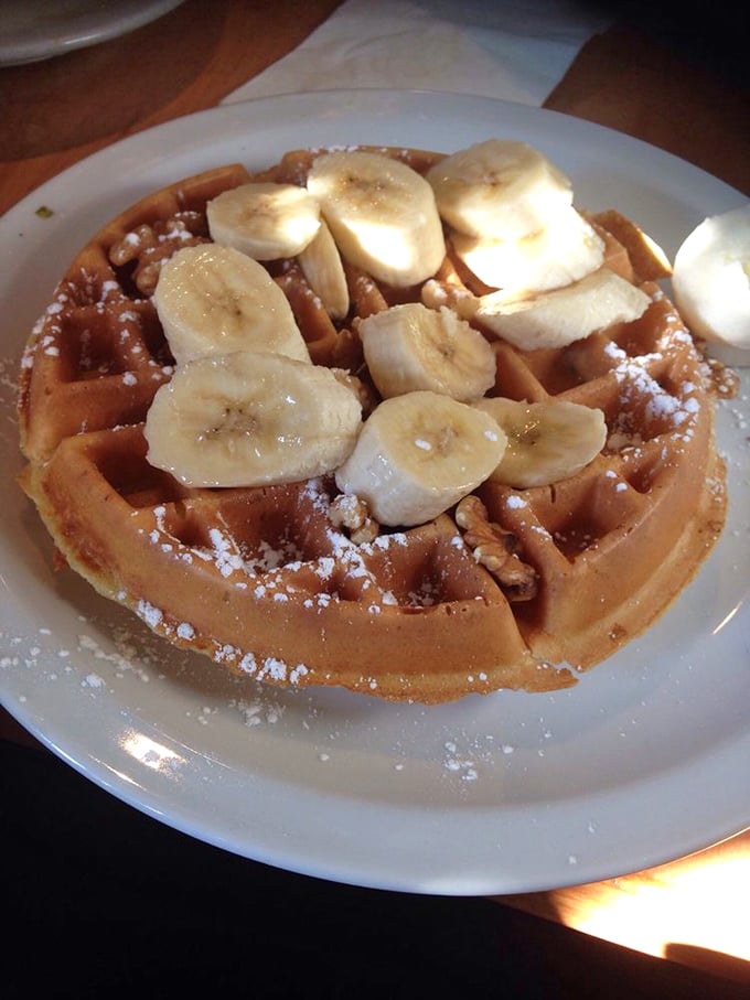 Bananas and waffles: a relationship that makes peanut butter and jelly look casual. This golden disc topped with fresh slices is breakfast's power couple.
