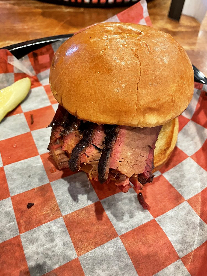 This brisket sandwich is what carnivore dreams are made of &ndash; pink smoke ring peeking out like nature's way of saying "you're welcome."