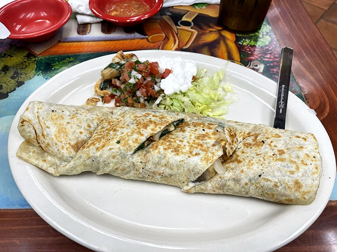 Behold the burrito that launched a thousand road trips. Golden-toasted exterior giving way to a masterpiece of fillings&mdash;this is edible architecture.