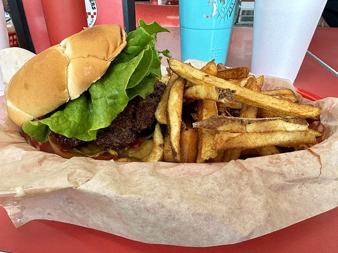 Tabasco sauce standing guard next to metal shakers&mdash;this burger doesn't need embellishment, but they respect your right to customize your bliss.