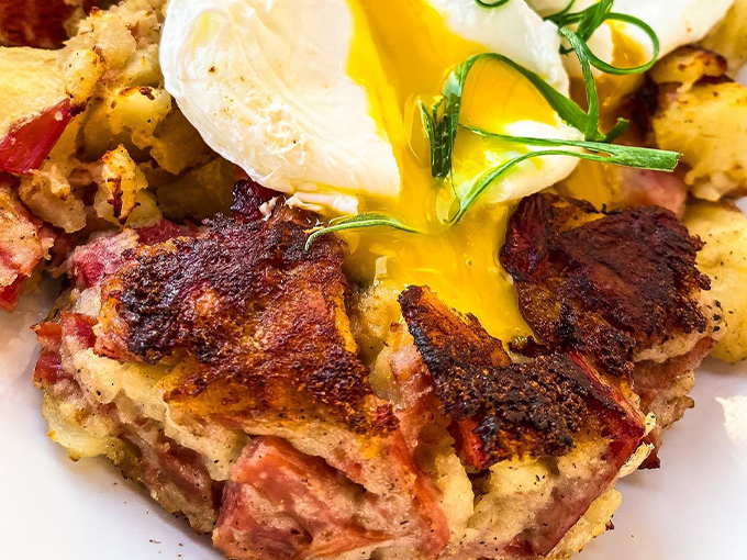 Breakfast nirvana exists and here's the proof: crispy-edged corned beef hash, runny-yolked eggs, and green onion garnish that's definitely not optional. 