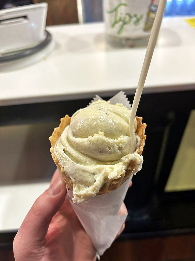 This scoop posing before its namesake sign is like a rock star taking a selfie with their platinum album&mdash;pure swagger in a cone.