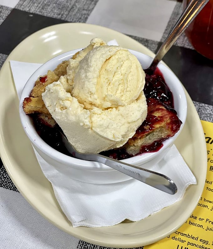 Berry cobbler wearing its vanilla ice cream crown like it knows exactly how good it is&mdash;warm, sweet, and worth every calorie.