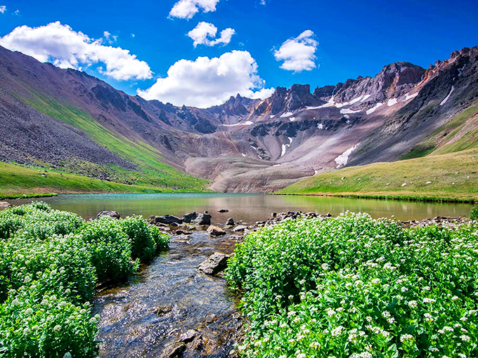 Alpine lakes don't get the Instagram fame of beaches, but they should. Blue Lakes Trail offers Colorado's version of Caribbean waters, minus the humidity and plus mountain majesty.