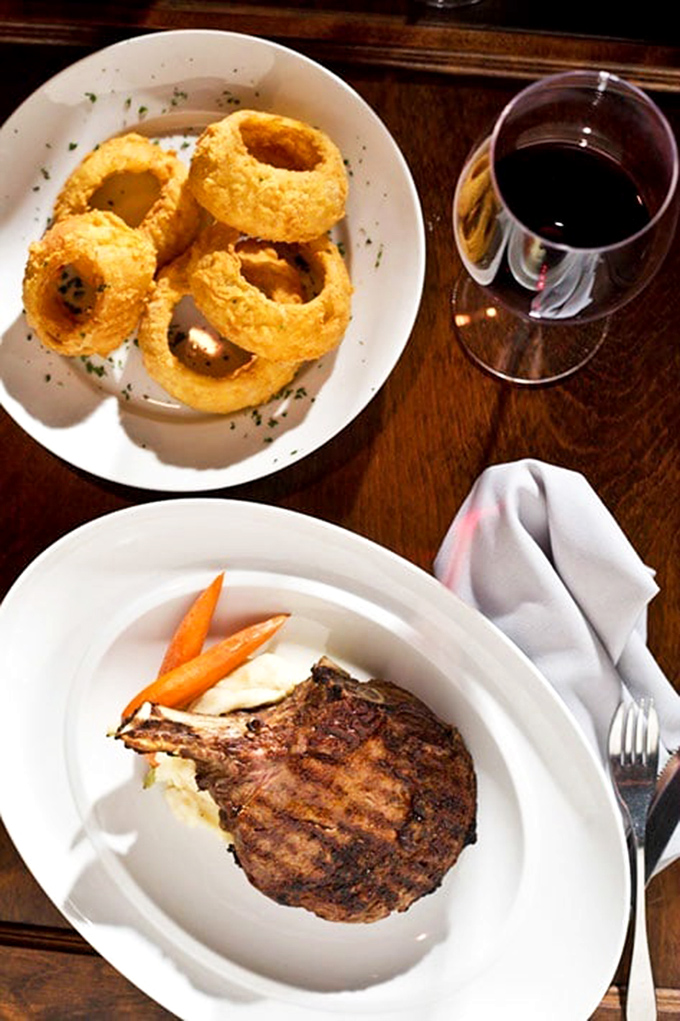 A bone-in ribeye that makes you understand why our ancestors fought over fire. The grill marks alone deserve their own Instagram account.