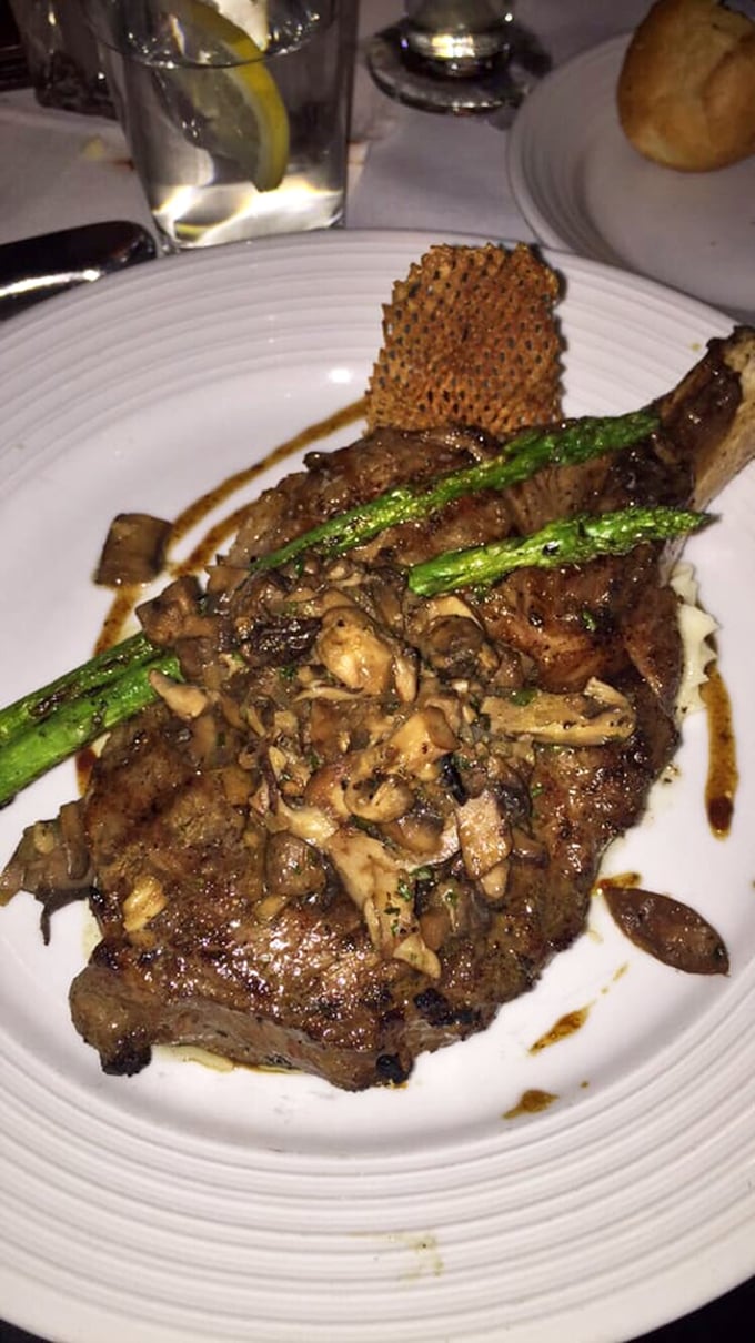 Behold the bone-in ribeye with its crown of mushrooms and crossed asparagus spears. It's like the steak is saying, "Yes, I am royalty. Please proceed accordingly."