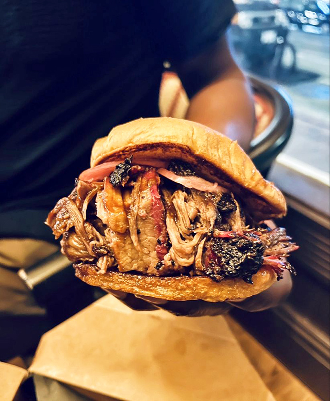 The pulled pork sandwich &ndash; where smoke, sauce, and pillowy bun create a holy trinity that makes you question why you ever ate anything else.