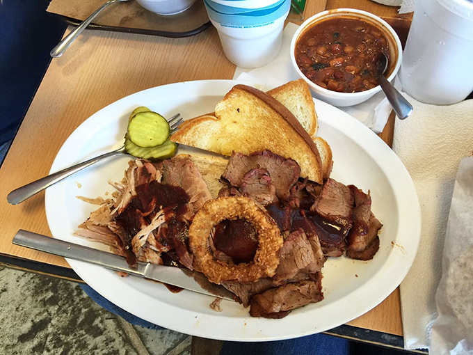 Meat diplomacy in action&mdash;brisket and pulled pork sharing a plate without conflict. Those beans deserve UN recognition for peacekeeping.