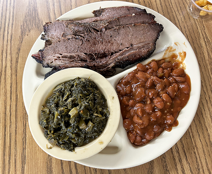 Brisket that doesn't need a passport to compete with Texas, paired with greens and beans that could make a vegetarian reconsider their life choices.