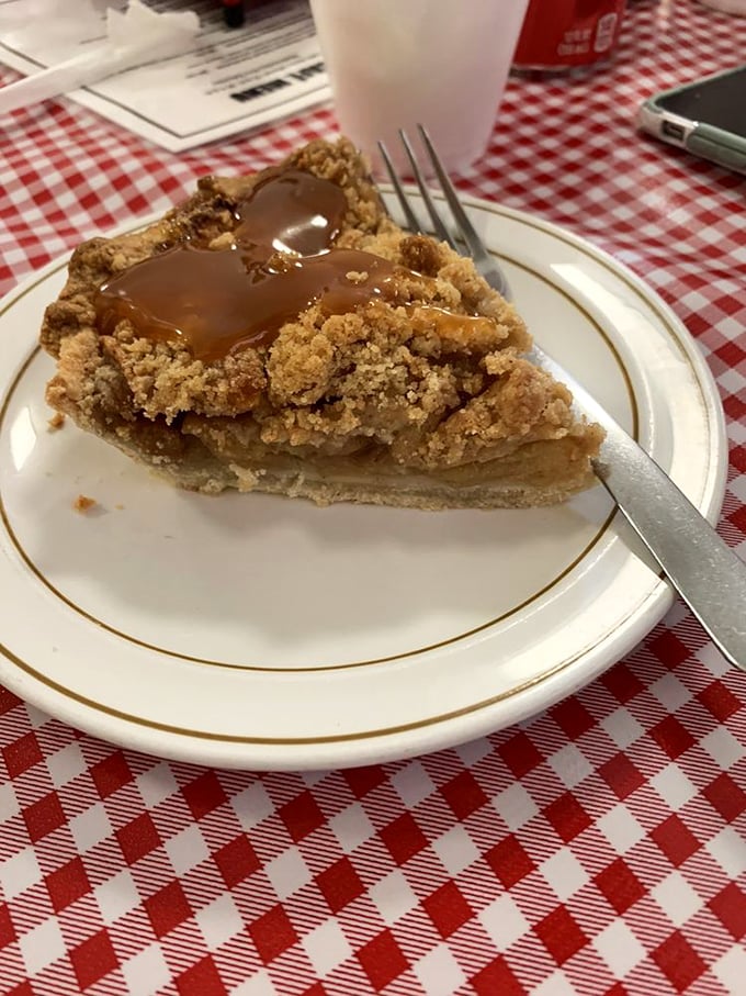 The crumb-topped apple pie with caramel drizzle doesn't just satisfy a sweet tooth&mdash;it reconciles you with every disappointing dessert you've ever experienced.