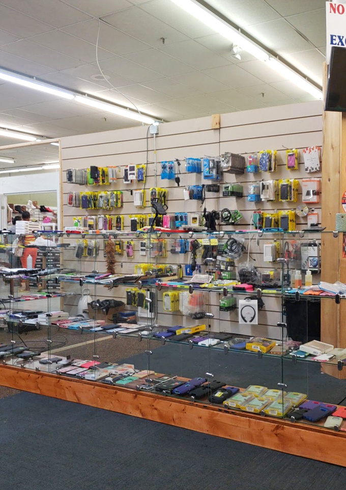 A tech lover's candy store where phone cases, chargers, and gadgets create a wall of modern necessities at decidedly un-modern prices.
