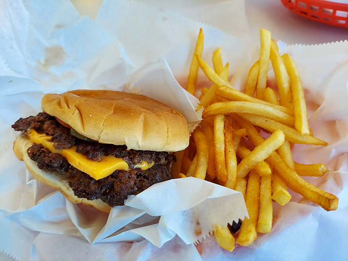 The dynamic duo of diner perfection &ndash; a juicy cheeseburger alongside golden fries that somehow manage to be both crisp and tender.