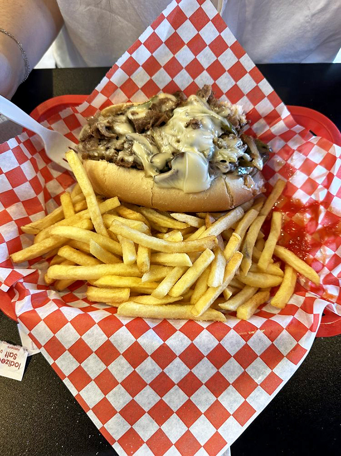 This isn't just lunch; it's a love letter written in beef and cheese, with a side of perfectly crisp fries as the postscript.