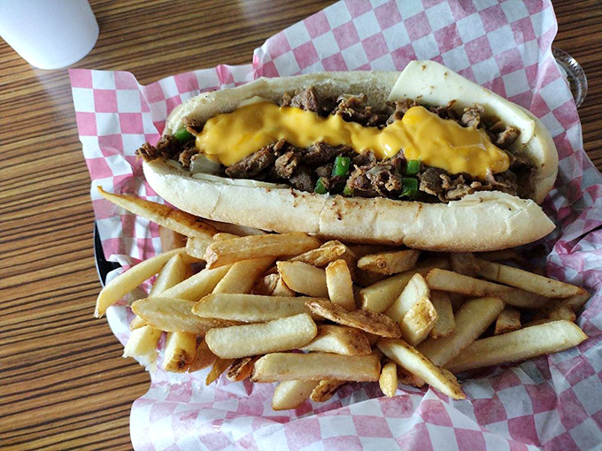 Cheez Whiz cascades over thinly sliced beef like a golden waterfall of deliciousness. This is comfort food that hugs your soul.