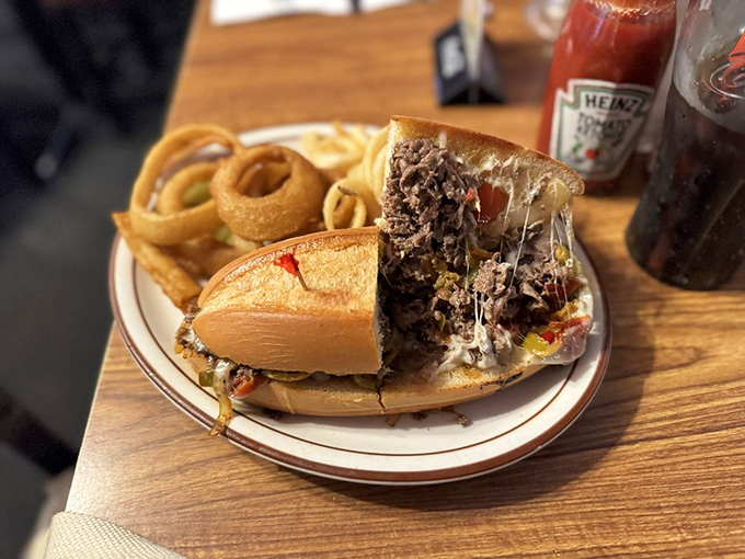 That cheesesteak is making a serious commitment to cheese&mdash;the kind of relationship we should all aspire to. Those onion rings look like golden halos.