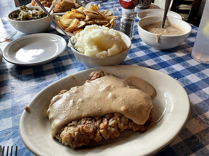 Chicken fried steak draped in gravy with a side of mashed potatoes&mdash;the Midwest's version of "I love you" served on a plate.
