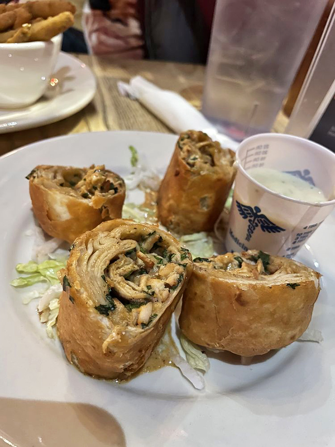 Crispy on the outside, tender surprise within. These chicken spring rolls deliver that perfect crunch sound that makes everyone at nearby tables look over with envy.