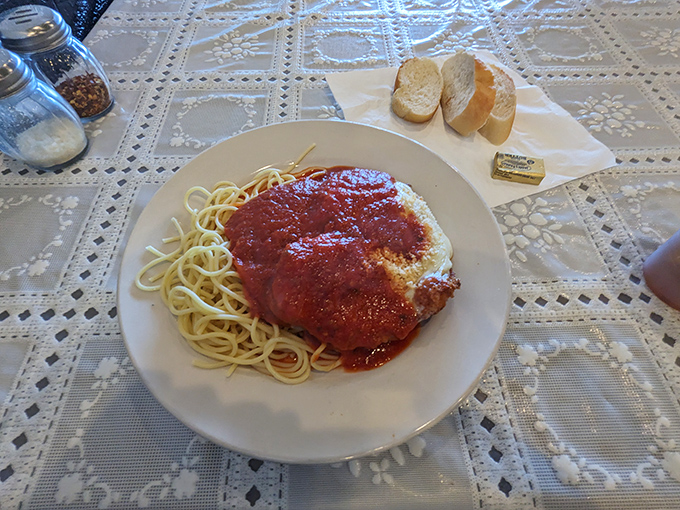 Chicken Parmesan that doesn't hide under a mountain of cheese, but stands proud on its bed of spaghetti. This is confidence on a plate.