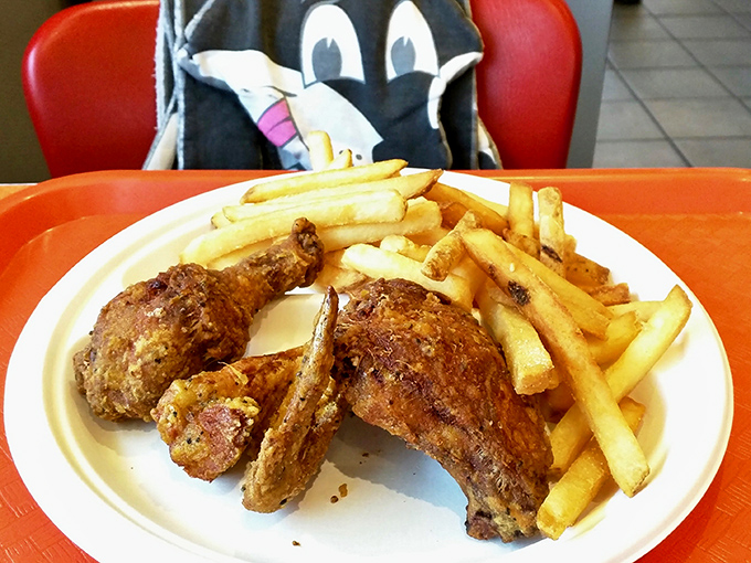 A plate that speaks the universal language of comfort. Those golden fries alongside perfectly seasoned chicken pieces are what food dreams are made of.