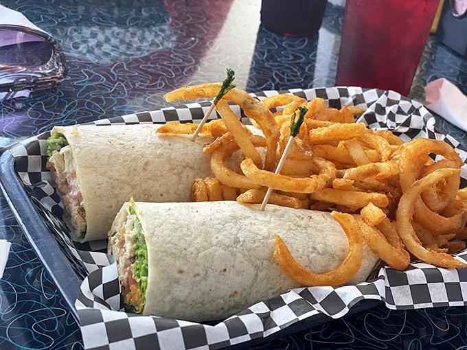 These wraps fly off the plates faster than a Cessna at takeoff, paired with curly fries that put boring straight ones to shame.