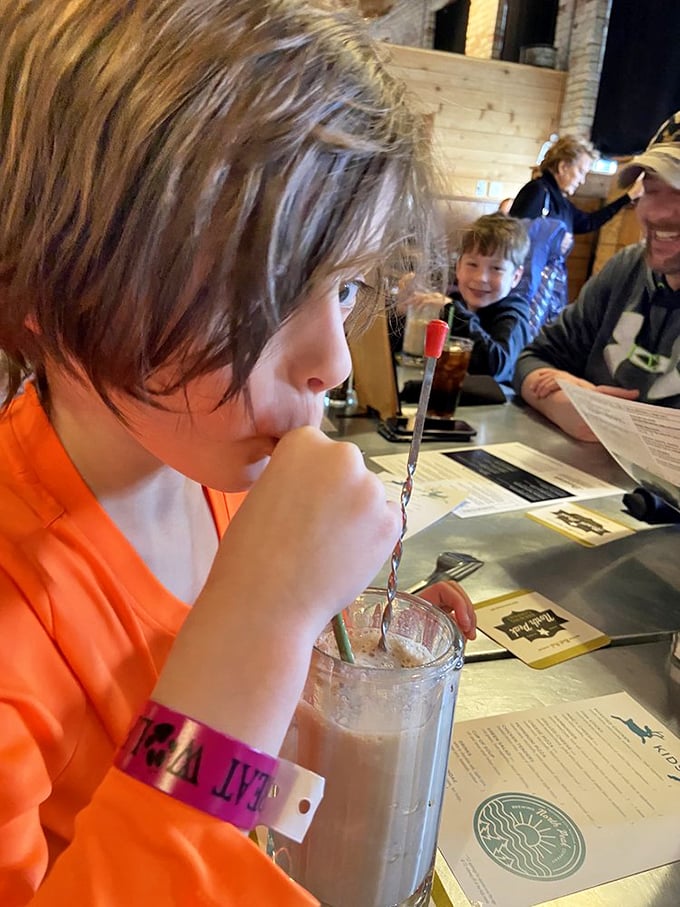 Young connoisseurs know where the good stuff is! Even kids pause their endless energy to savor that perfect root beer through a straw.