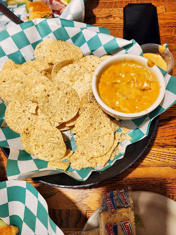 That golden cheese dip isn't just an appetizer—it's practically an Arkansas handshake, welcoming you with warm, melty hospitality.