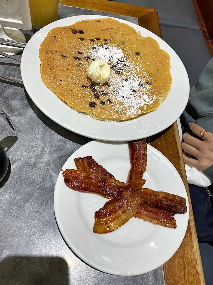 This chocolate chip pancake is what breakfast dreams are made of &ndash; a perfect circle of happiness with bacon on the side.