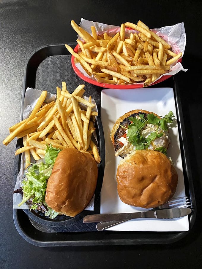 Two burgers, twice the joy&mdash;a feast fit for royalty served on humble metal trays. Democracy never tasted so good.