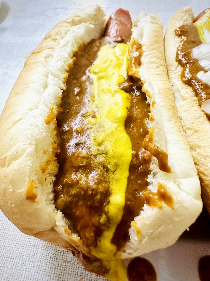 Some call it sacrilege to skip the onions, but even in its minimalist form, that signature chili transforms an ordinary hot dog into Detroit royalty.