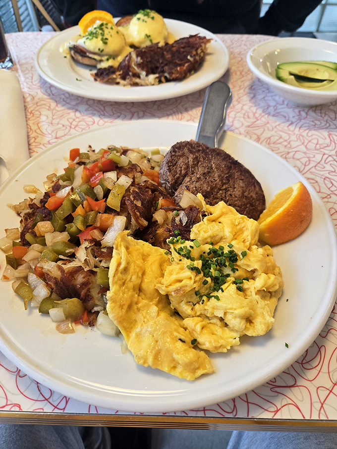 A western omelet that's had a meaningful relationship with hash browns, alongside toast that's achieved that perfect golden-brown glow. 