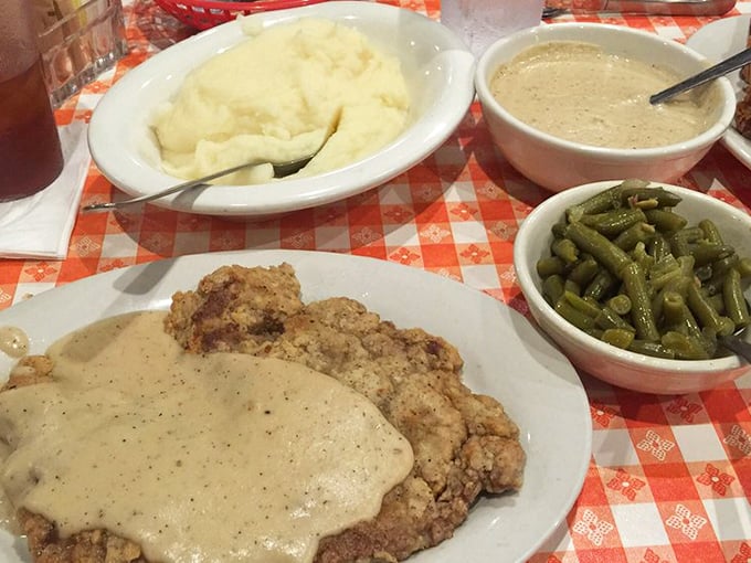 The holy trinity of comfort: country fried steak, mashed potatoes, and green beans. Notice how the gravy touches everything – as it should.