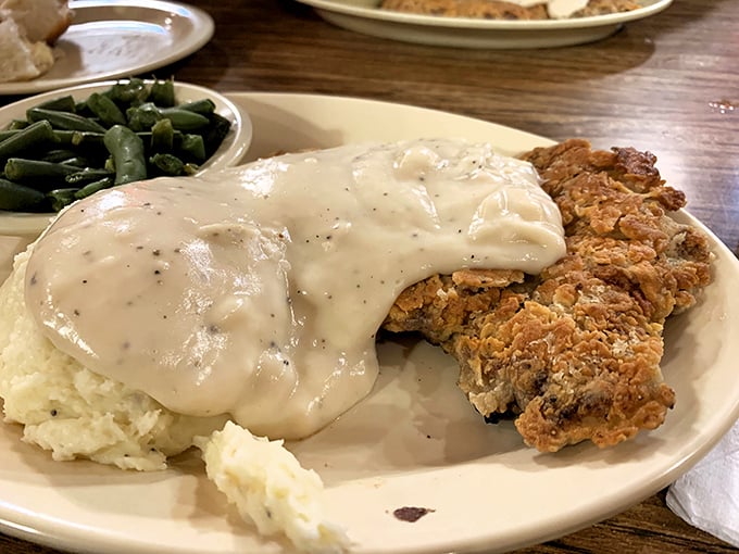 This isn't just dinner&mdash;it's edible nostalgia, with each bite of gravy-drenched steak transporting you to simpler times. 